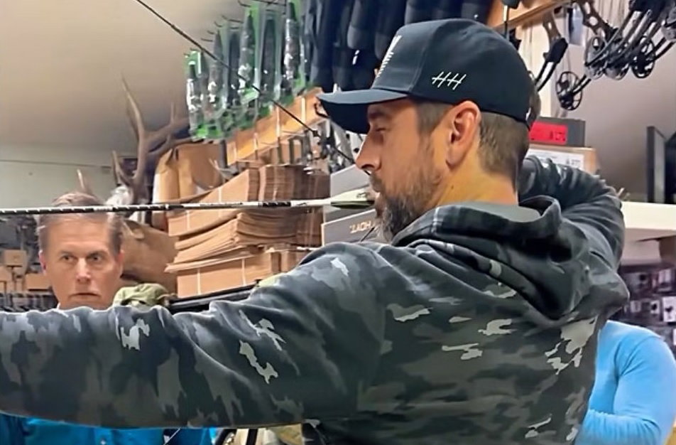 Aaron Rodgers Practicing His Aim With Compound Bow During Achilles ...
