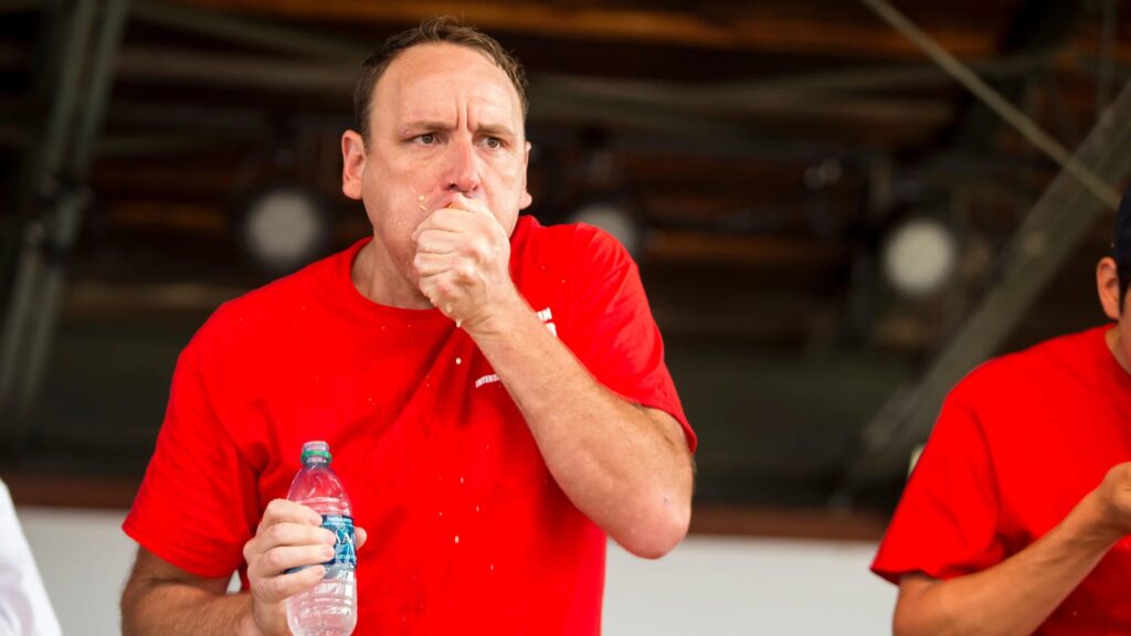 Joey Chestnut Breaks World Record, Defeats Kobayashi in Netflix Hot Dog ...