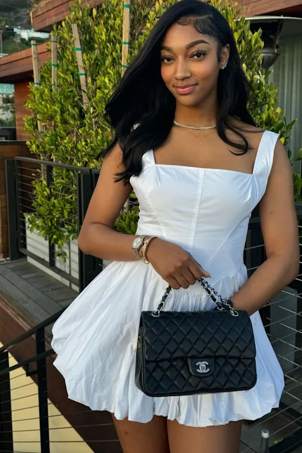 Angel Reese Stuns in White Dress While Posing with Usher at Concert - TMSPN