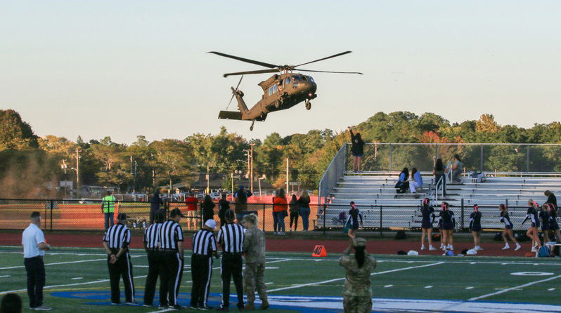 High School Football Players Battle for Loose Ball Dropped from ...