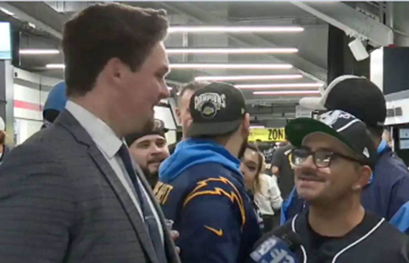 Wild Chargers-Raiders Fan Fight Interrupts Live TV Interview in Chaotic ...