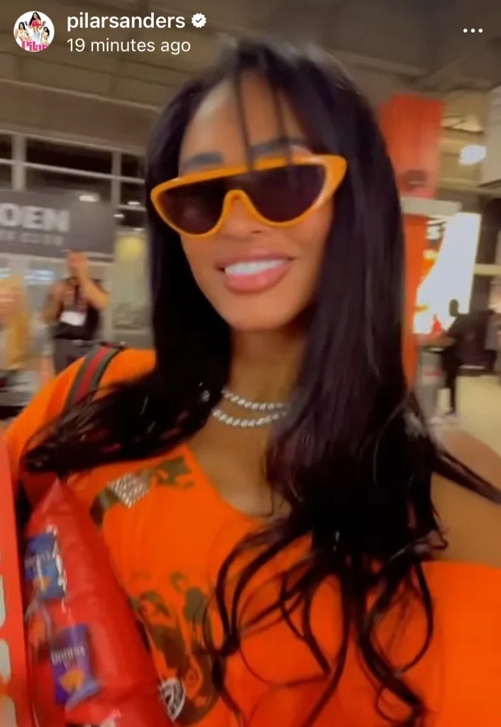 Pilar Sanders Steals the Spotlight in Custom Orange “12” Top While ...