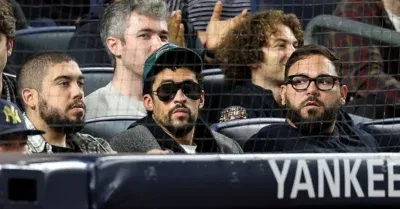 Bad Bunny Faces Backlash After Remaining Seated During ‘God Bless ...