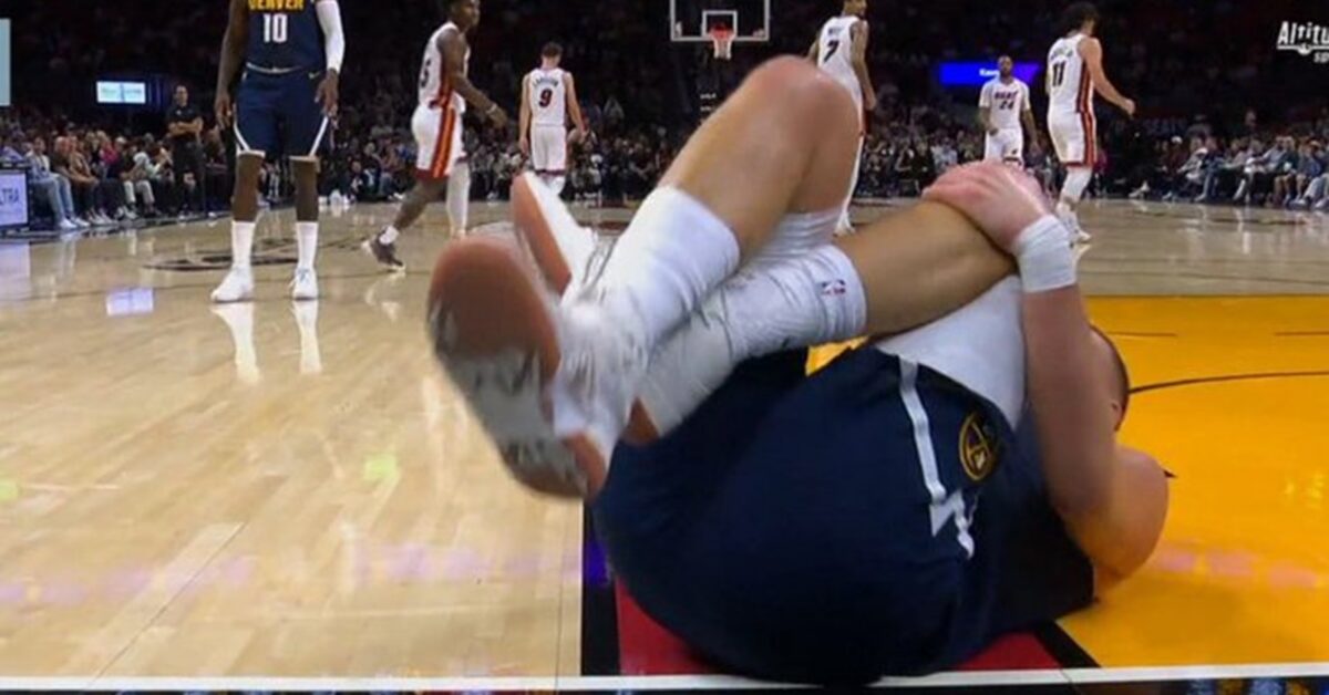 Nikola Jokic Suffers Scary Knee Injury After Awkward Fall - TMSPN